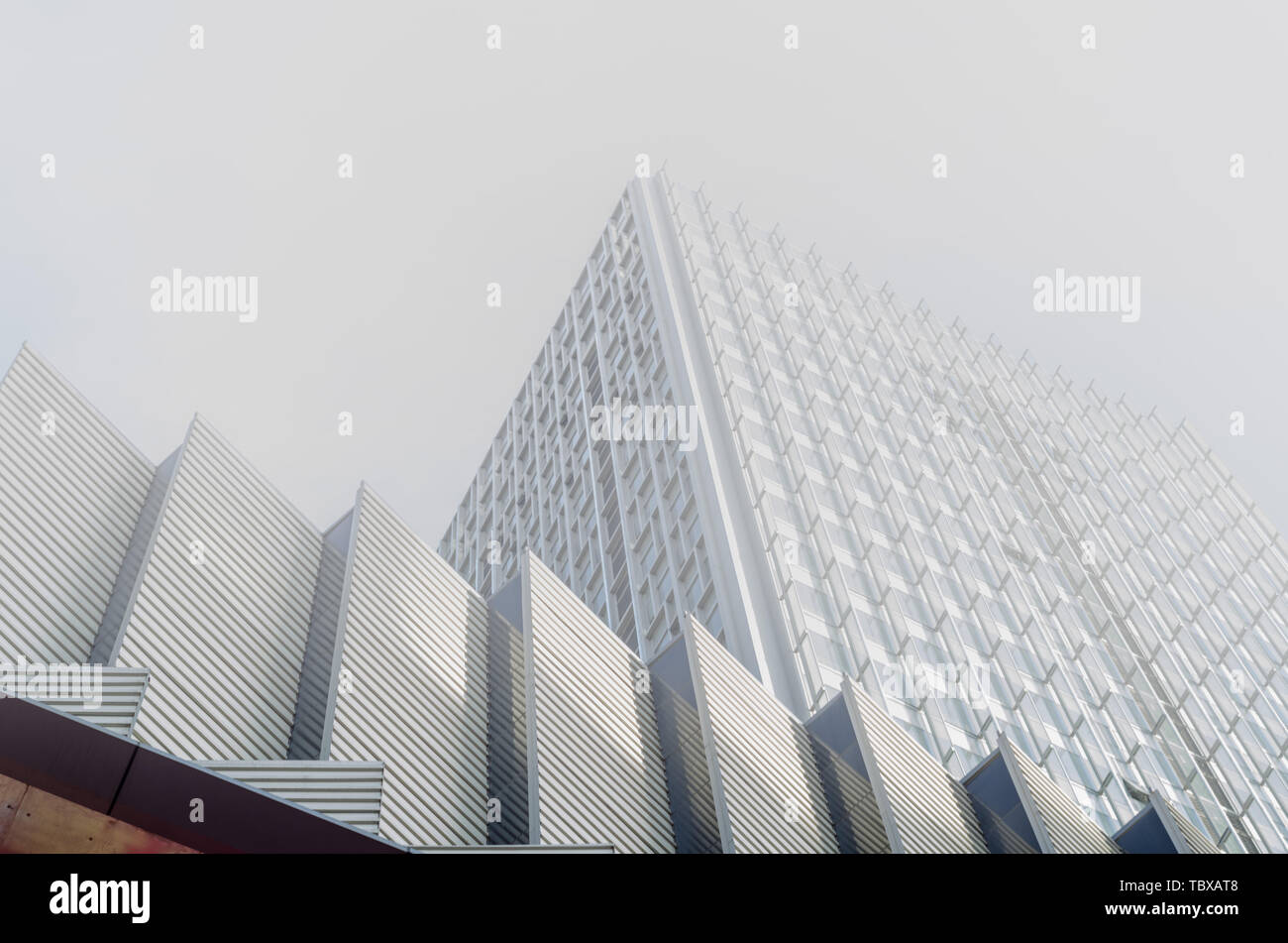 The foggy weather hits the city of high-rise building Stock Photo - Alamy