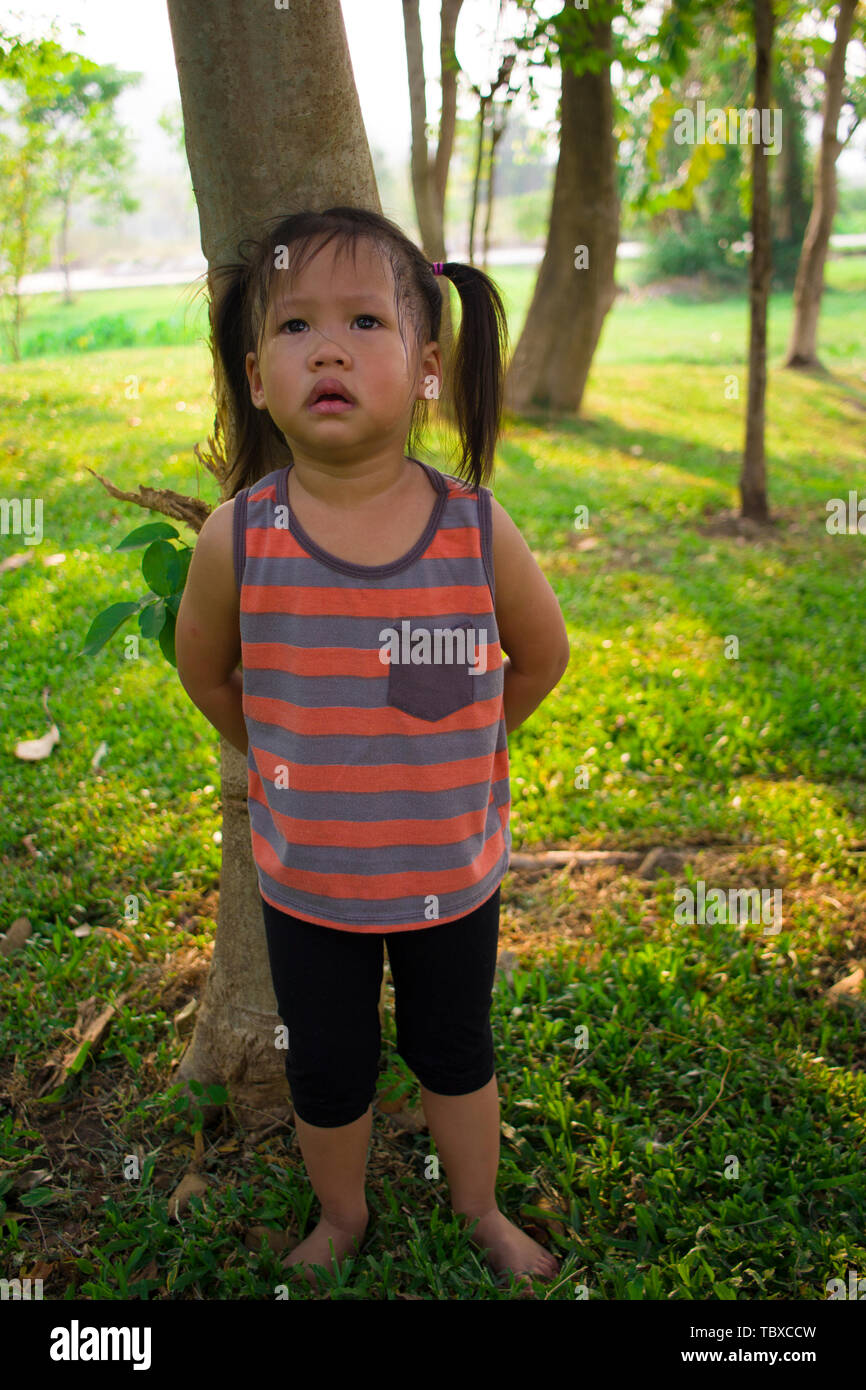 Baby Girl crying, Asian little girl crying and sad on summer background ...