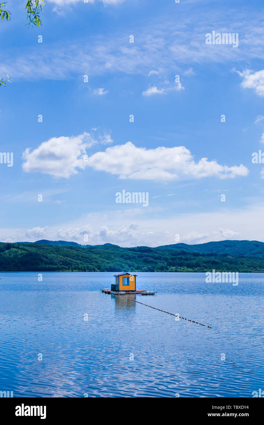 Orange cottage on floating water Stock Photo - Alamy