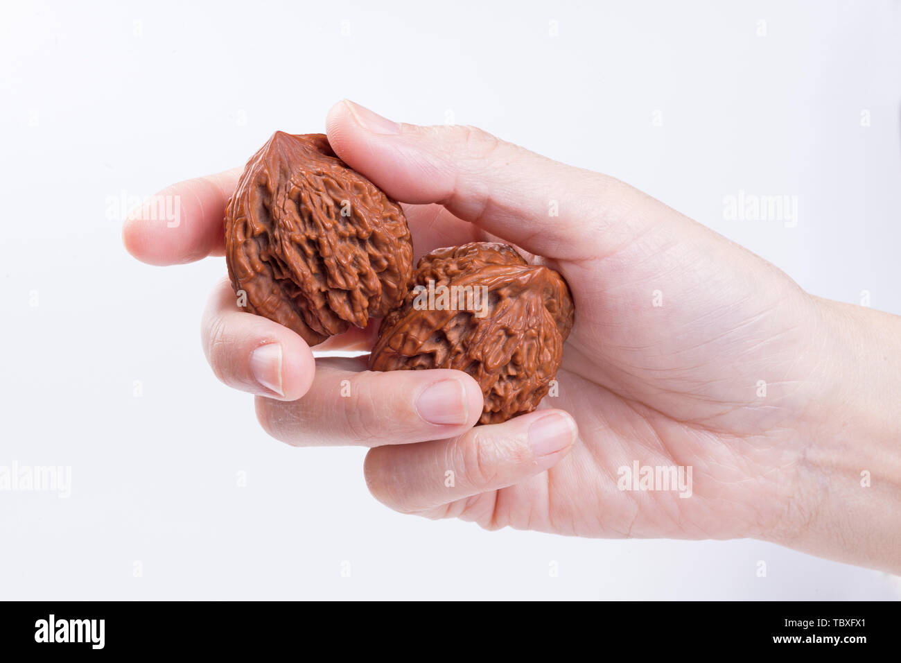 Hand dish walnuts Stock Photo - Alamy