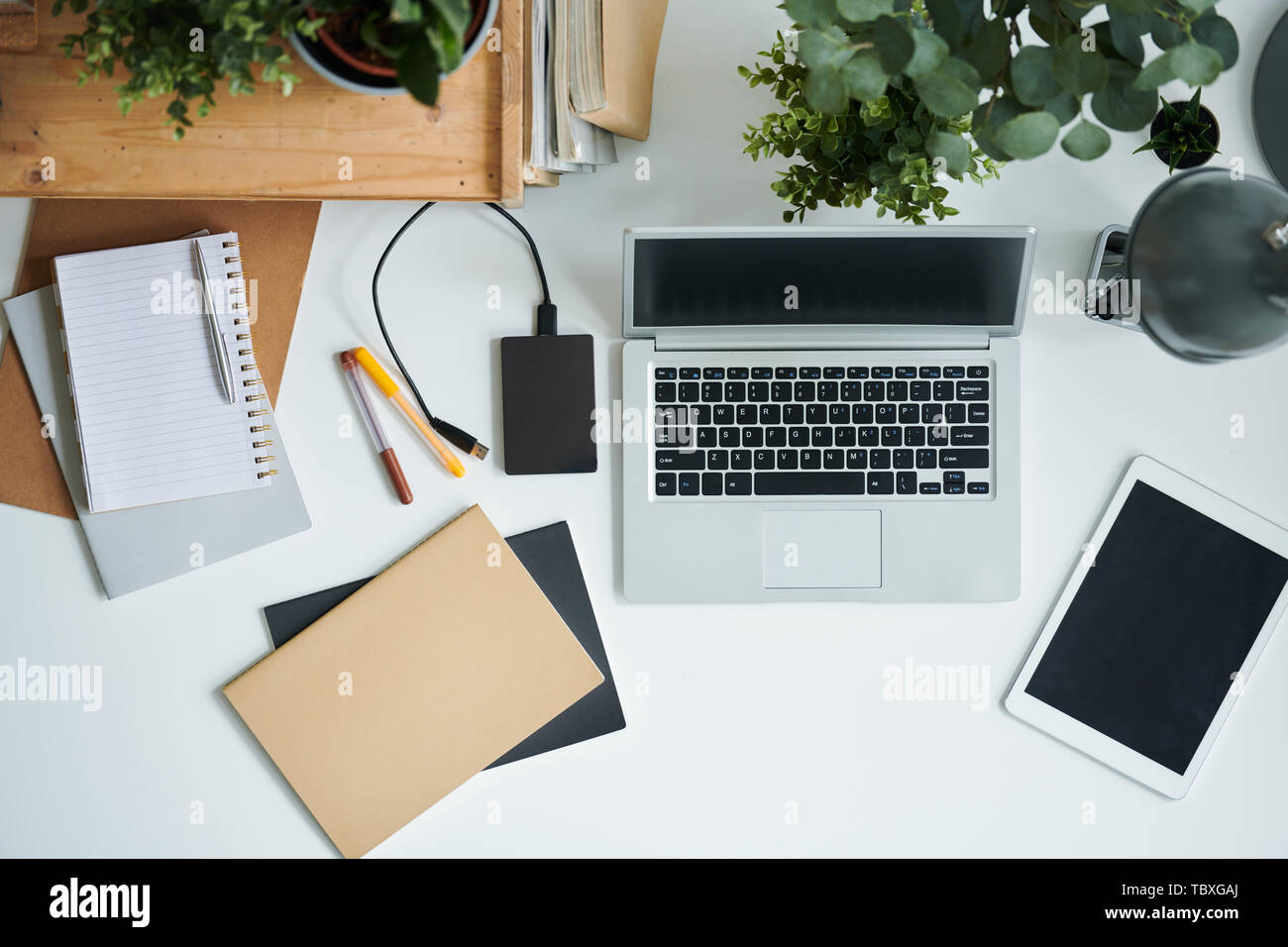 Gadgets and copybooks Stock Photo - Alamy