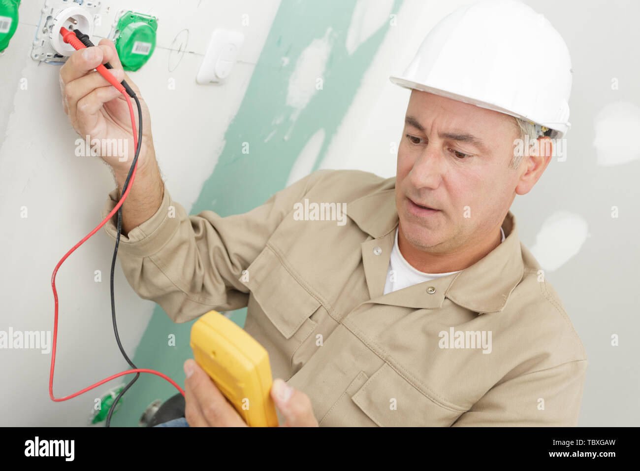 technician using voltage meter for voltage measurement Stock Photo - Alamy