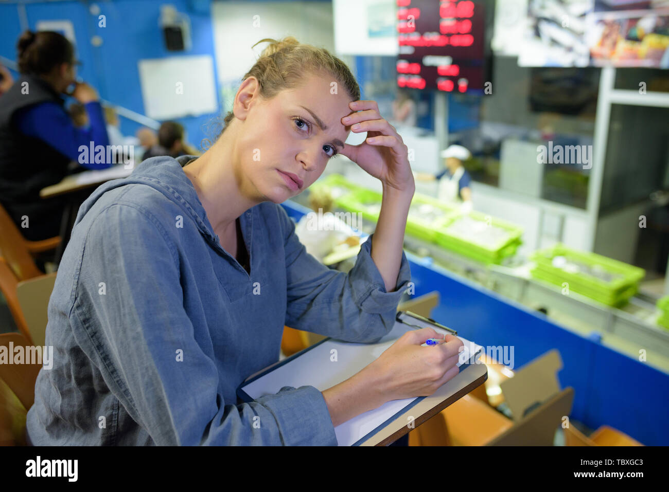 annoyed female clerk working in supermarket Stock Photo - Alamy