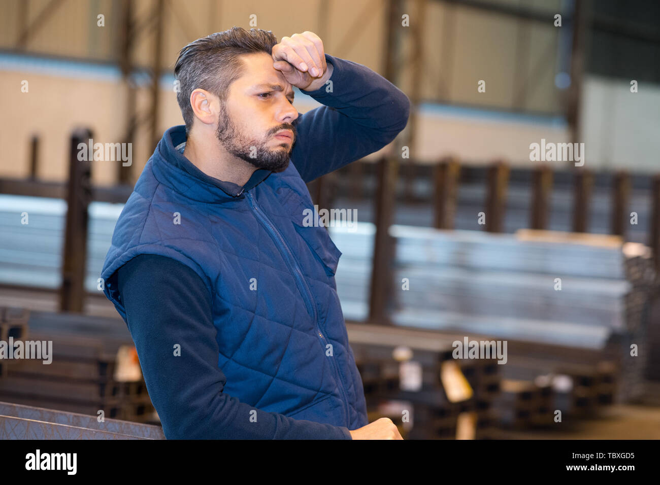 tired young engineer working Stock Photo - Alamy