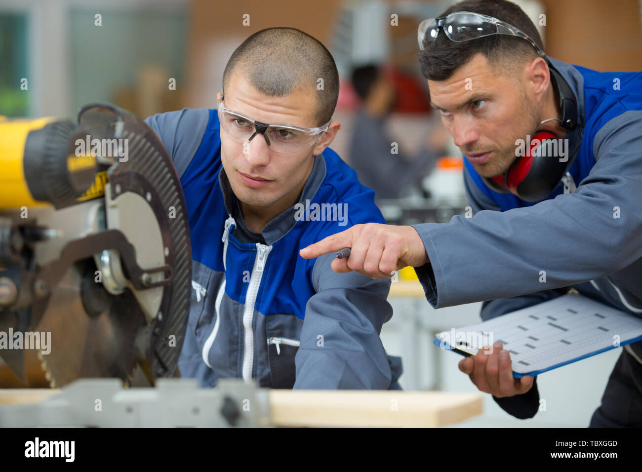 industrial worker cutting metal with circular blade Stock Photo - Alamy