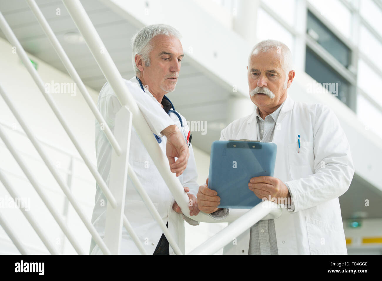 two senior doctors talking Stock Photo - Alamy