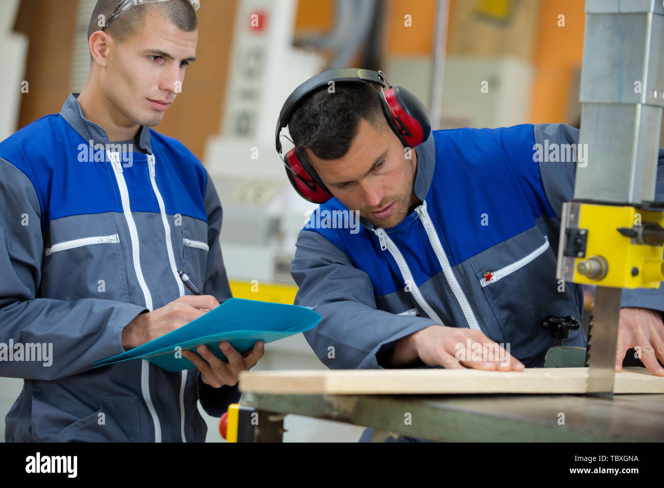 two engineers are working with wood Stock Photo - Alamy