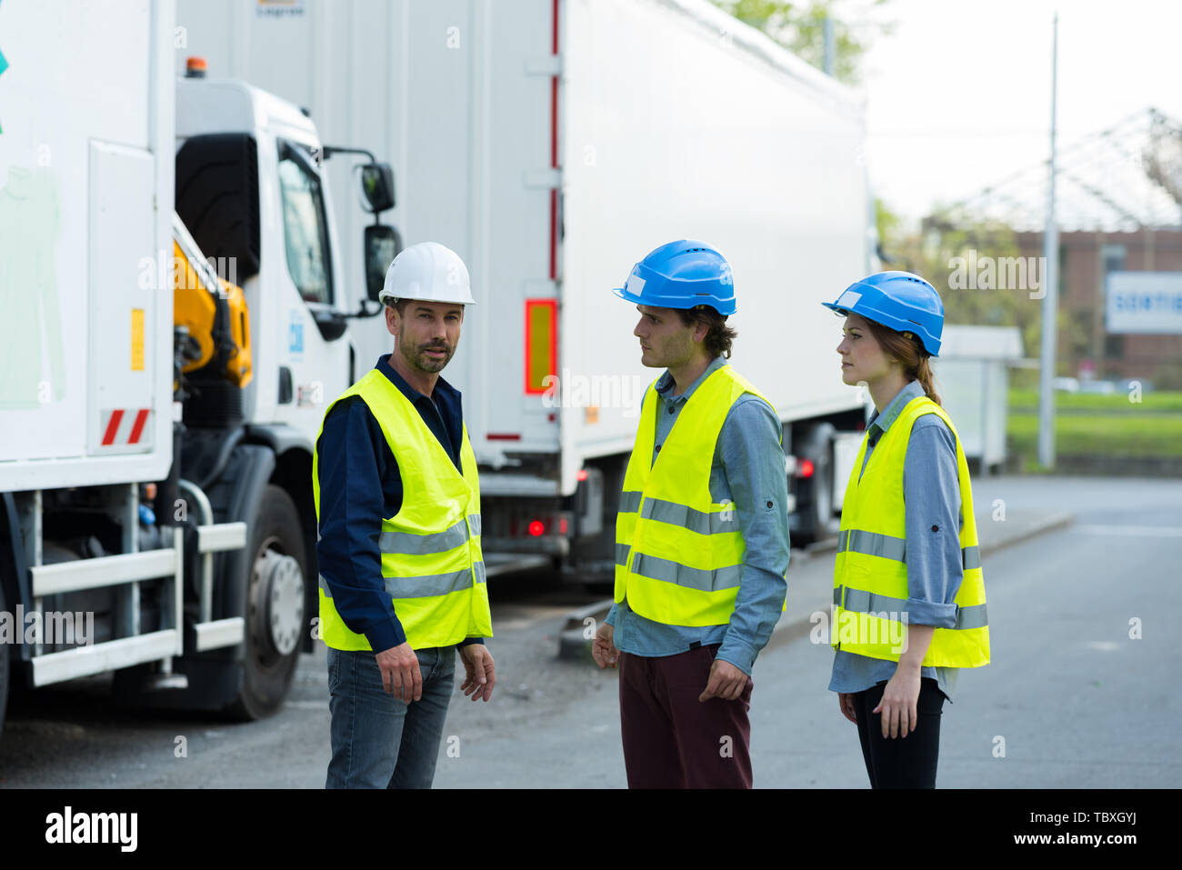 construction workers at the back of a lorry Stock Photo - Alamy