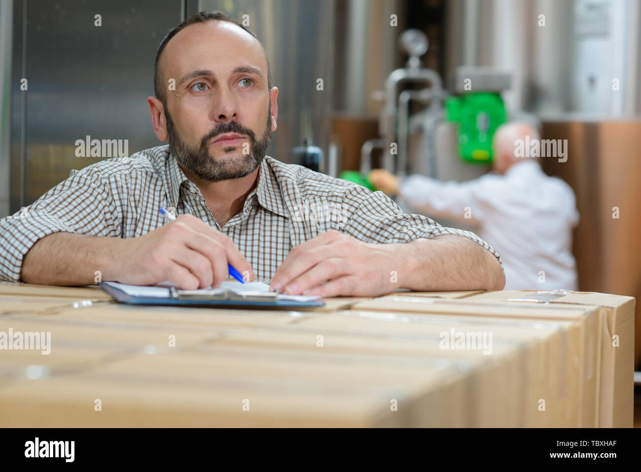thinking man and shop warehouse Stock Photo - Alamy