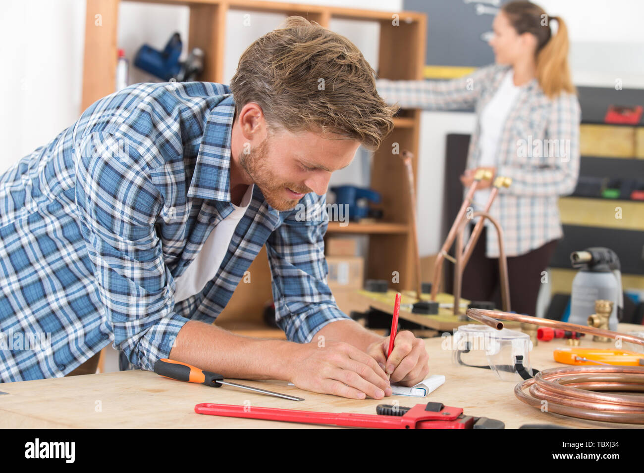 Left handed woman at work hi-res stock photography and images - Alamy