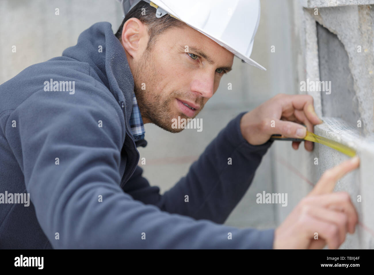 repair home man makes measurement Stock Photo - Alamy