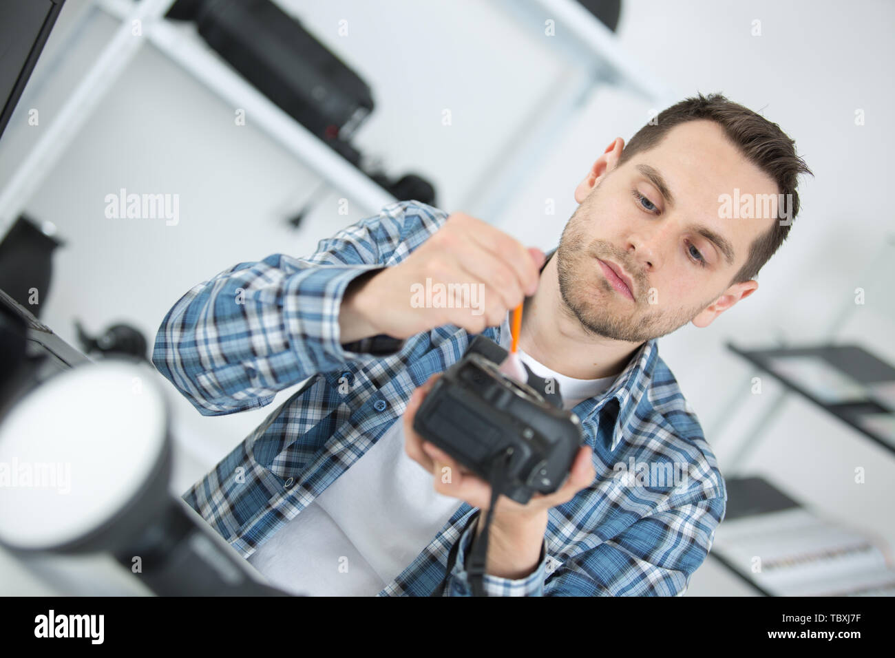 photographer cleaning the lens Stock Photo - Alamy