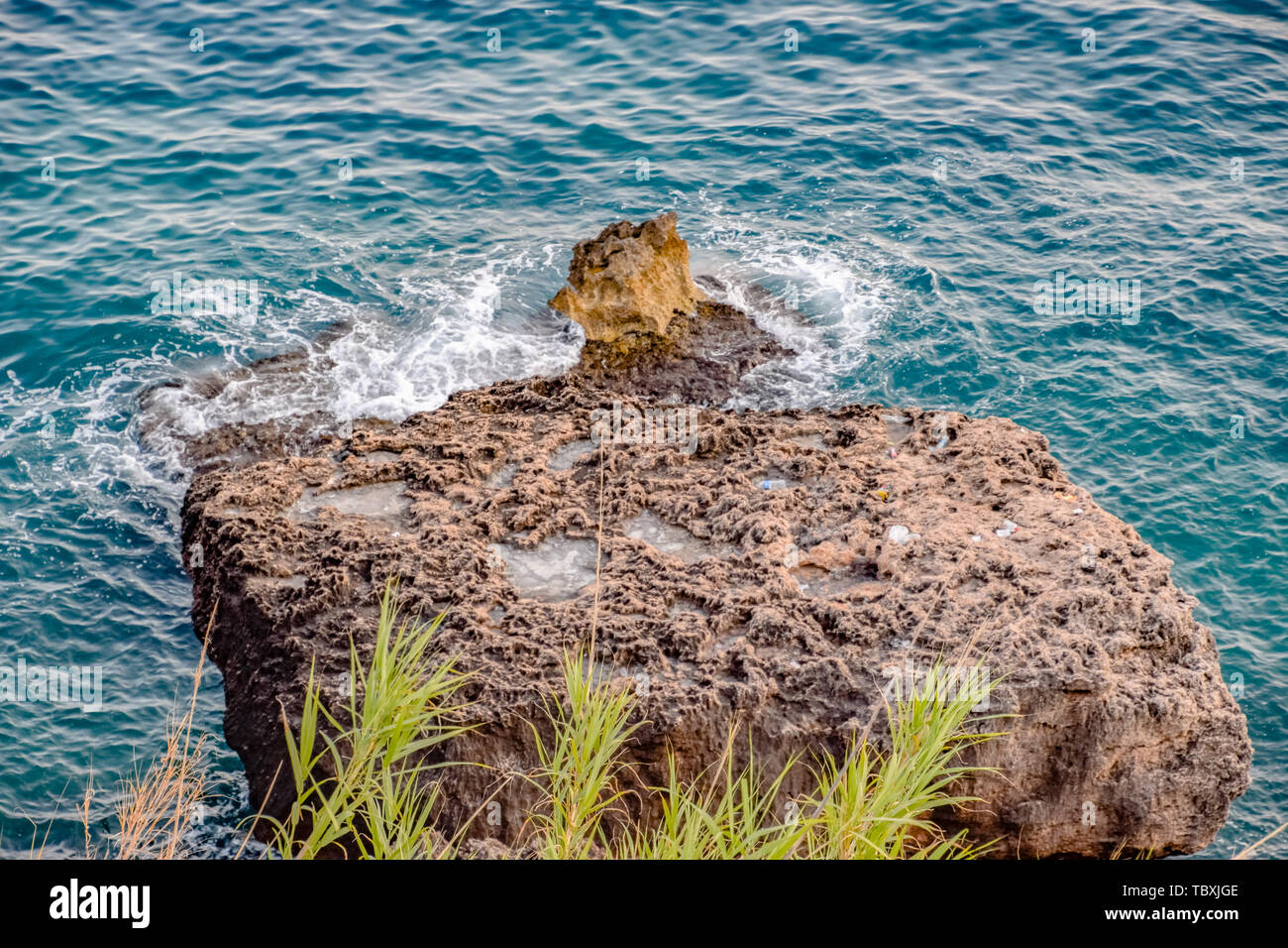 Limestone cliffs by the sea. Waves beat on the rocks Stock Photo - Alamy