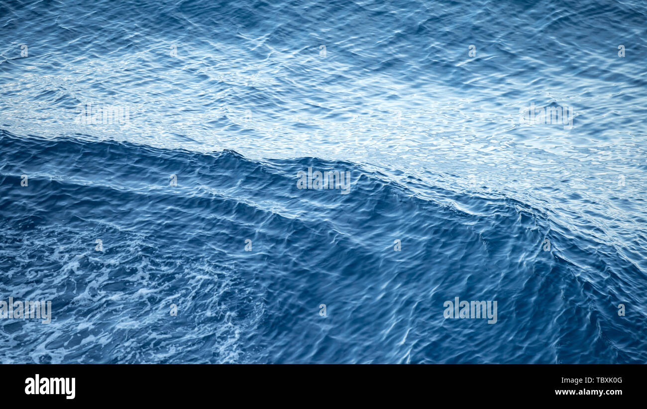 Glistening and shimmering blue ocean surface background with sun ...