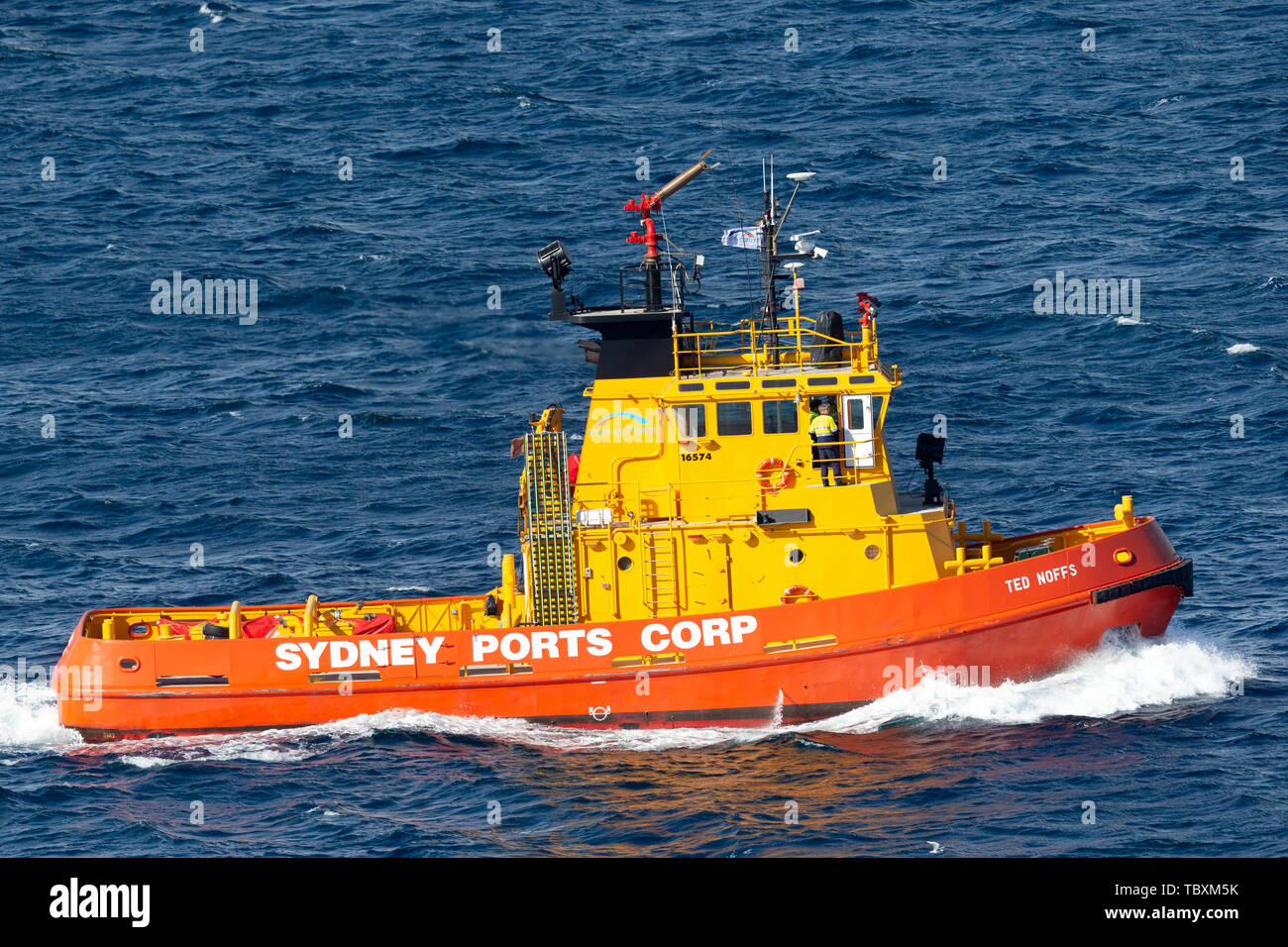 Sydney Ports corporations bright orange and yellow fire-fighting tugs ...