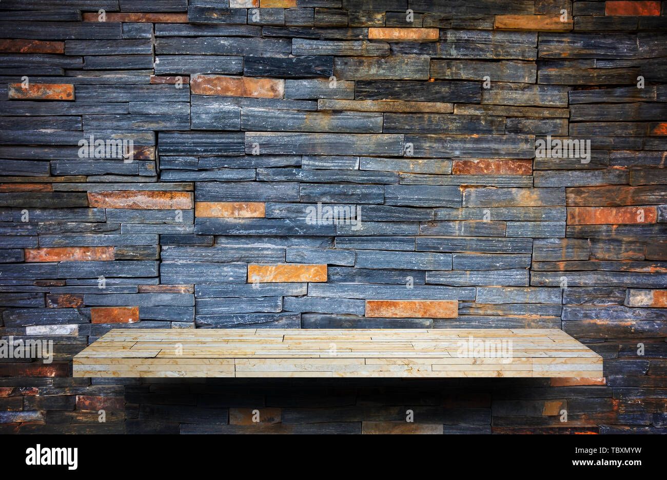 Cream Rock counter shelf on orangr black rock background Stock Photo ...