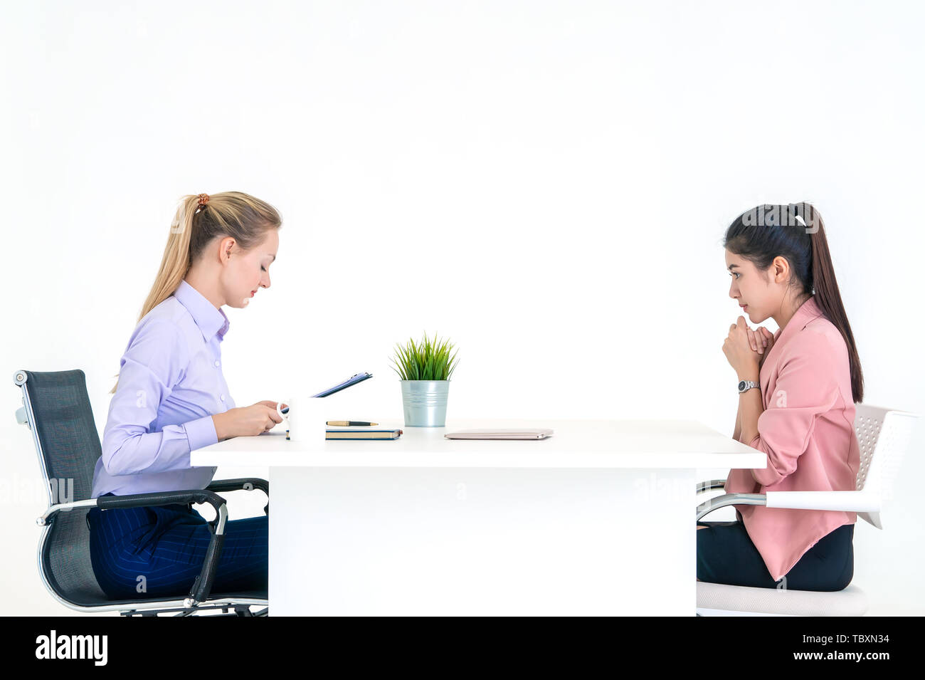 Woman during job interview with female boss Stock Photo - Alamy