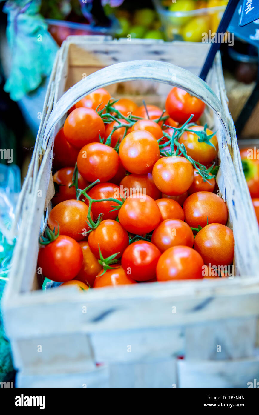 Tomatoes at the market display stall Stock Photo - Alamy
