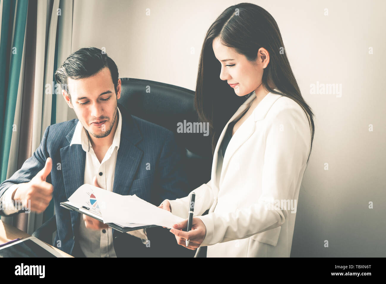 Business boss is giving complement to secretary business report Stock ...