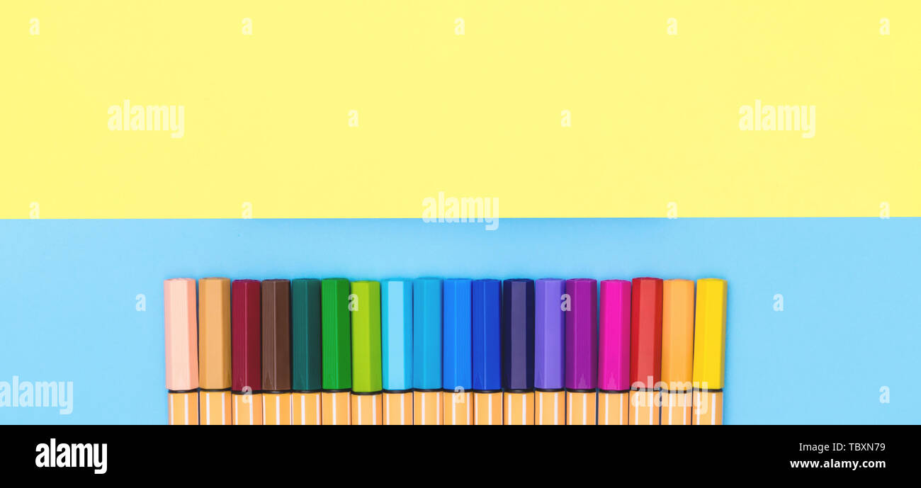 Color Marker pen line up on blue yellow background for copy space Stock ...