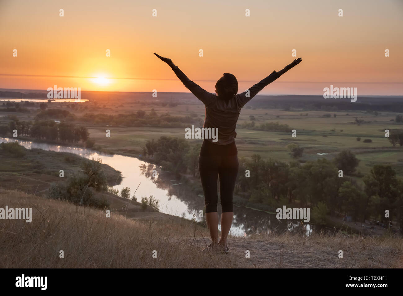 Meditation in sunrise summer field. Relax health concept Stock Photo ...