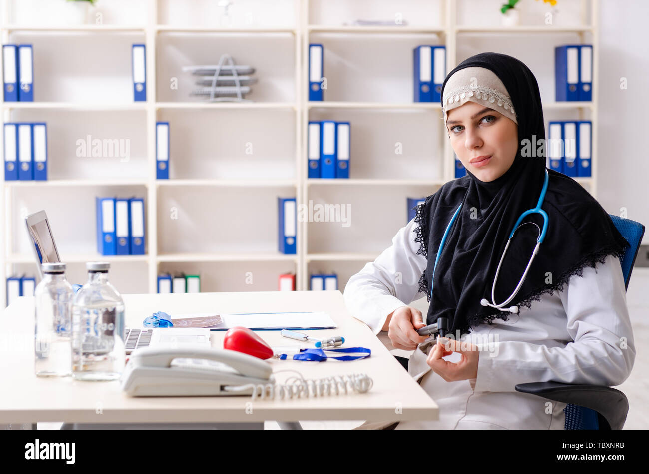 Young doctor in hijab working in the clinic Stock Photo - Alamy