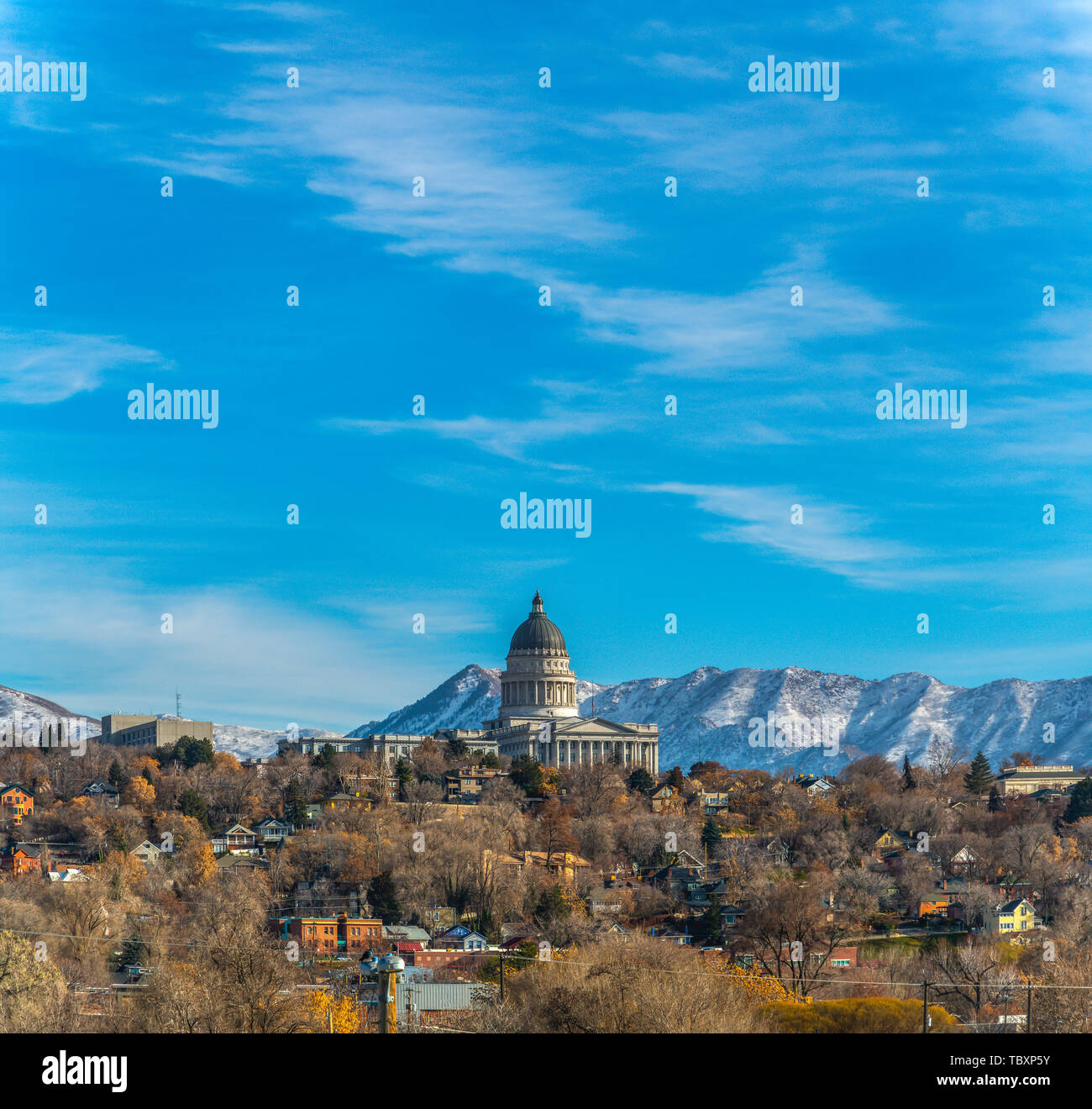 The majestic Utah State Capital Building towering over houses in Salt ...