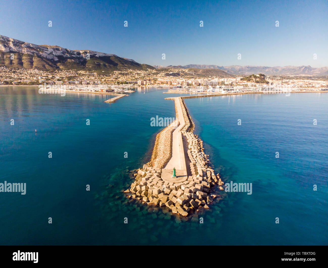 Aerial view of Denia port. Breakwater and a lighthouse in the ...