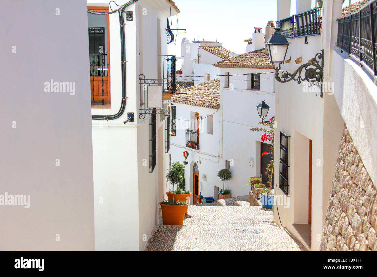 A traditional mediterranean street in Altea old town, Spain Stock Photo ...