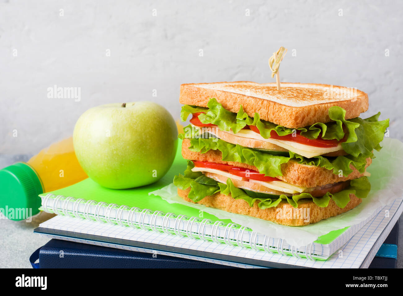 Healthy lunch for school with sandwich, fresh apple and orange juice ...