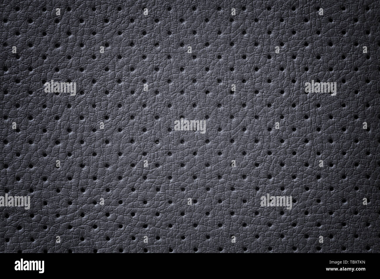 Perforated dark gray leather texture background with gradient frame ...