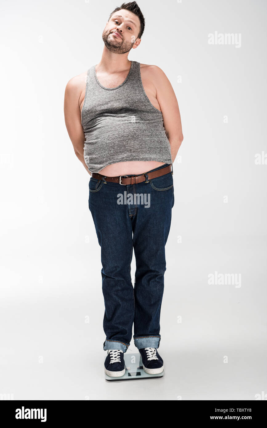 Overweight man standing on scales hi-res stock photography and images ...