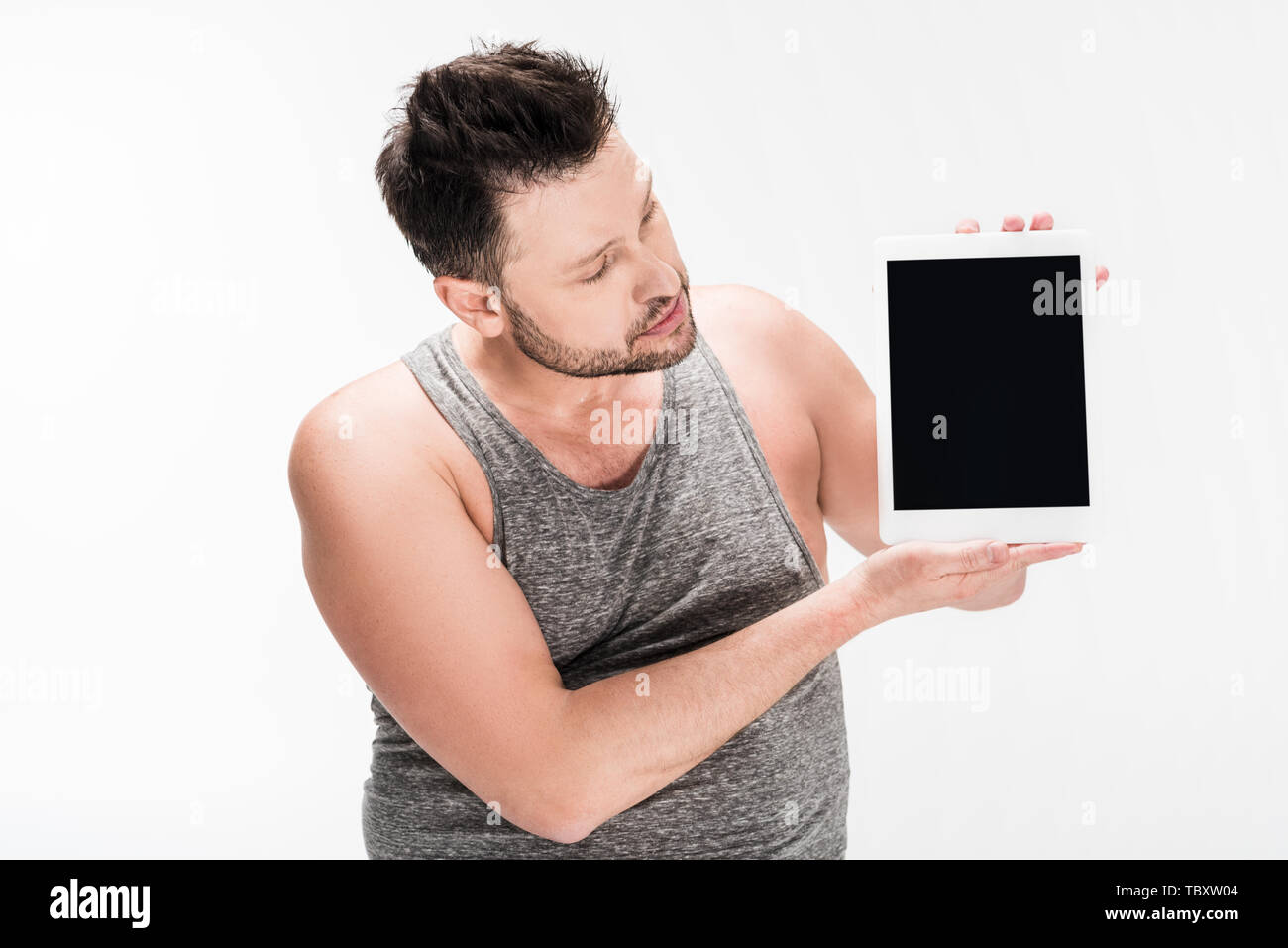 overweight man showing digital tablet with blank screen isolated on ...