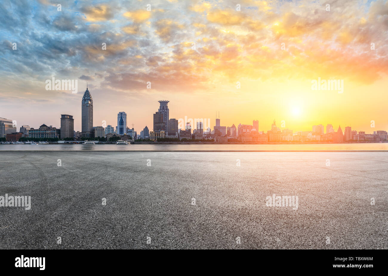 Shanghai bund city skyline and empty asphalt road ground at sunset ...