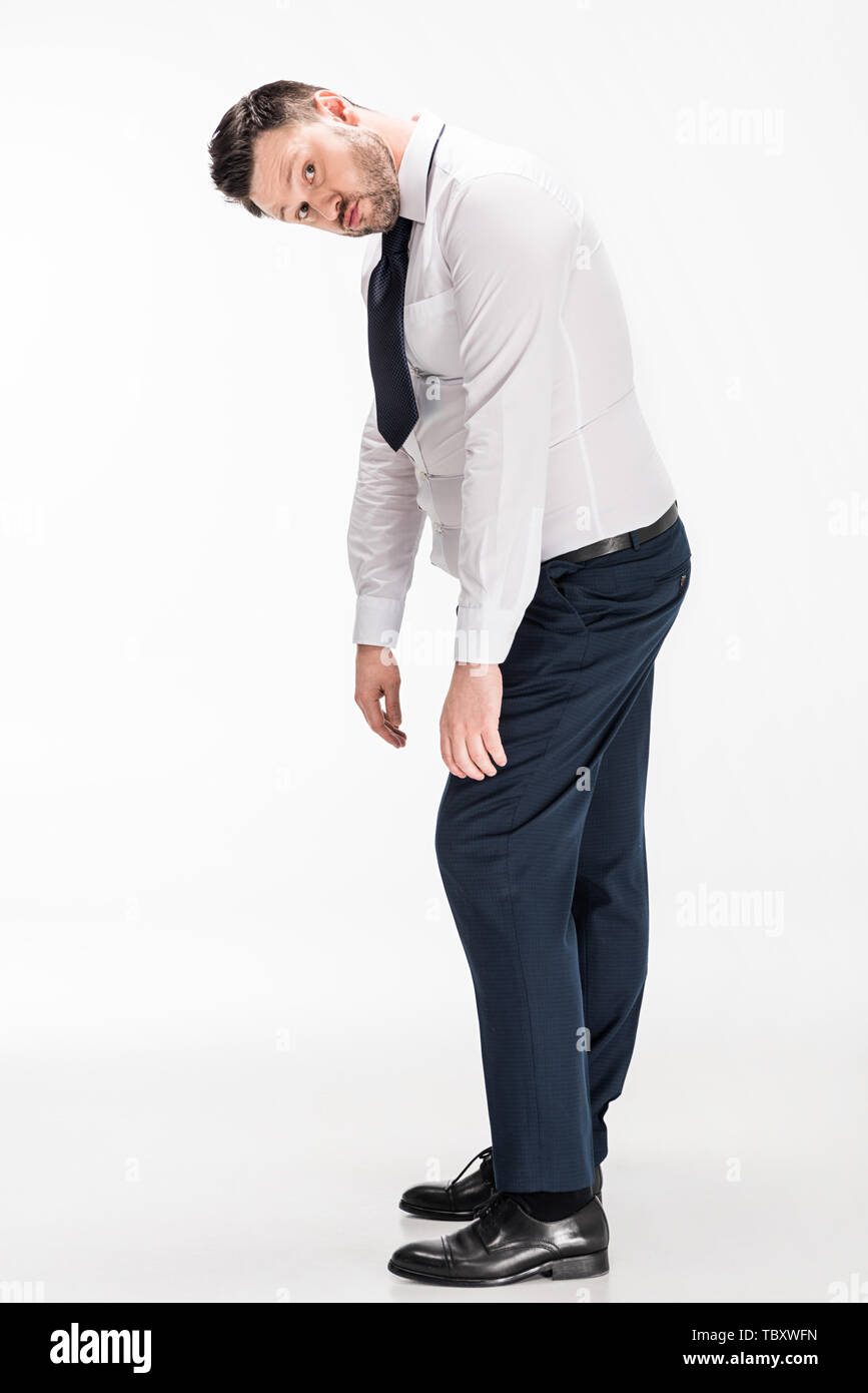 overweight man in tight formal wear looking at camera and bending over ...