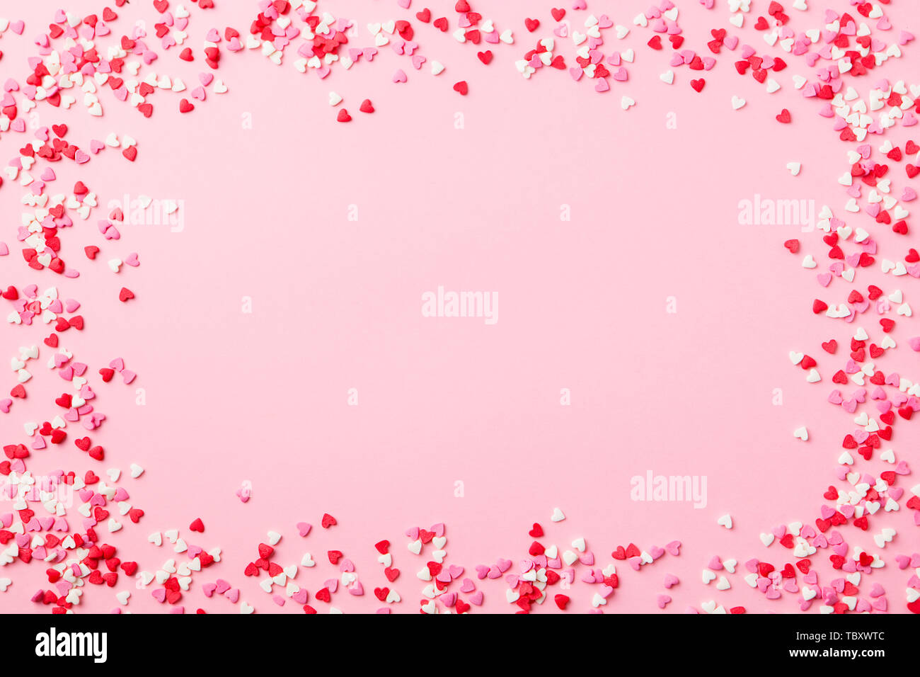Sugar hearts frame on pink background. Romantic, St Valentines day ...