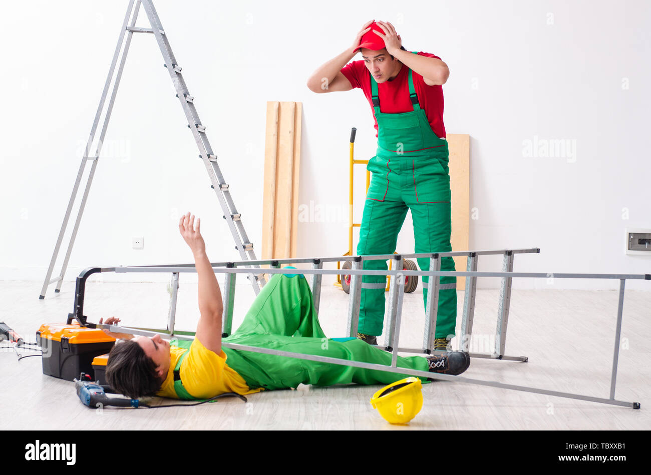 Injured worker and his workmate Stock Photo - Alamy