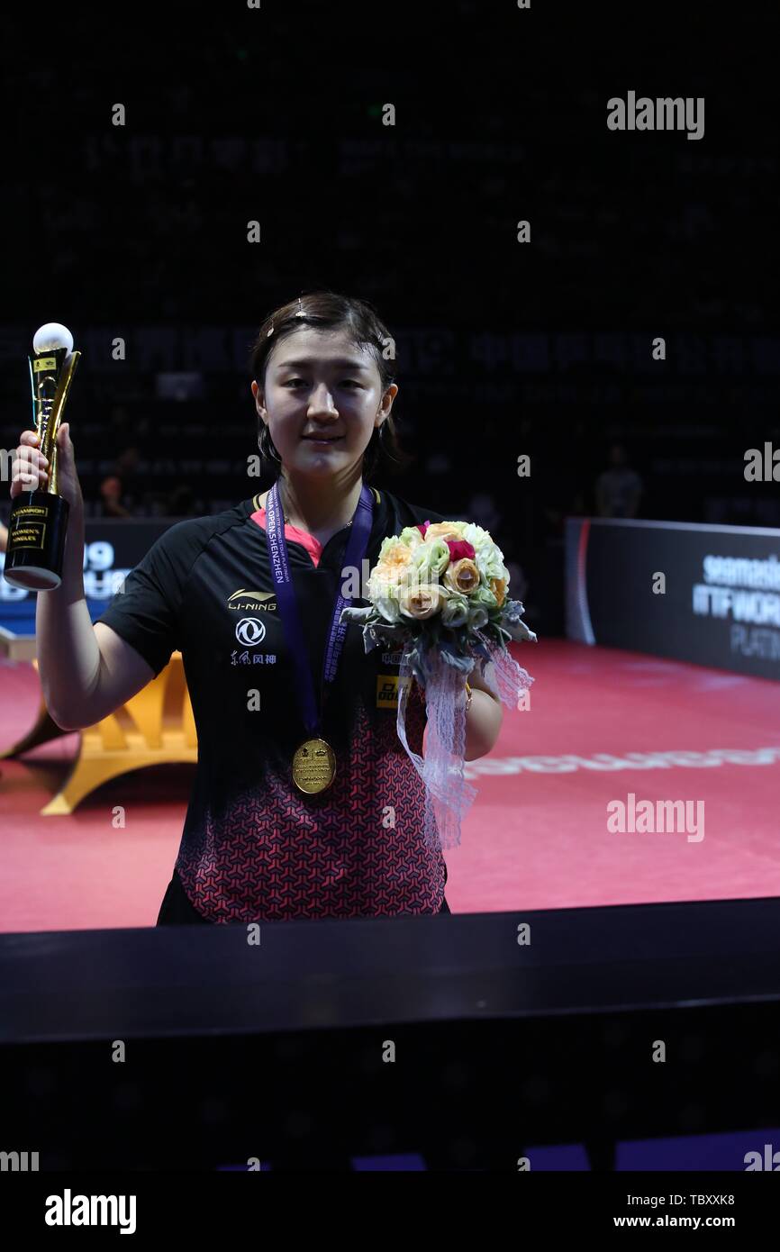 Chen Meng of China poses with her trophy after defeating Wang Manyu of ...