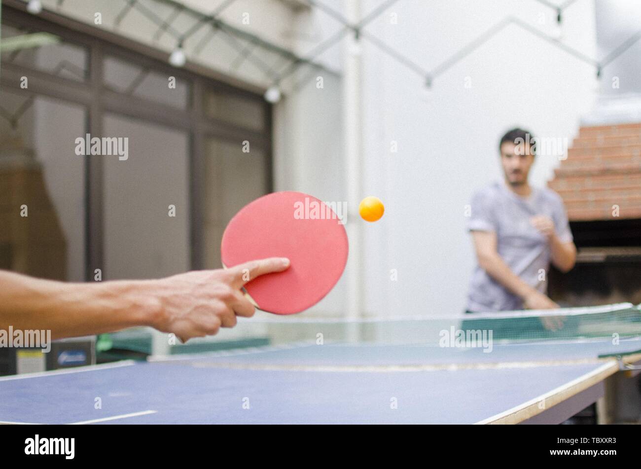 Closeup to a sportsman's hand playing table tennis Stock Photo - Alamy