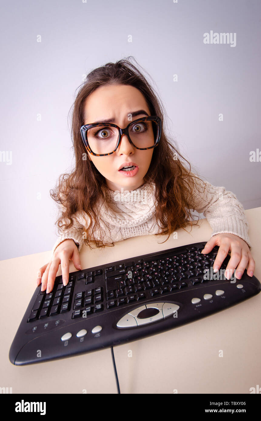 Funny nerd girl working on computer Stock Photo - Alamy