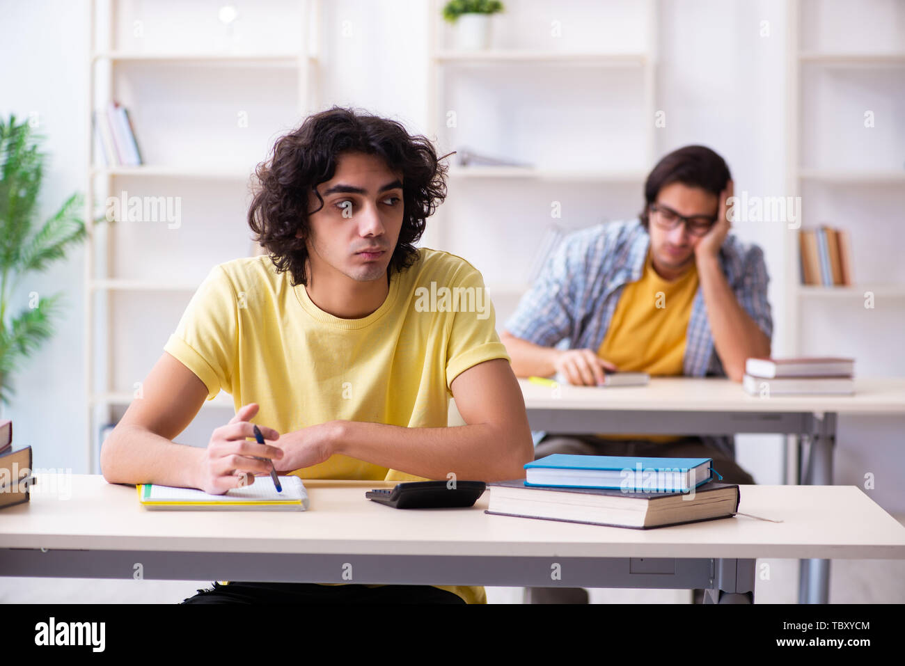 Two male students in the classroom Stock Photo - Alamy