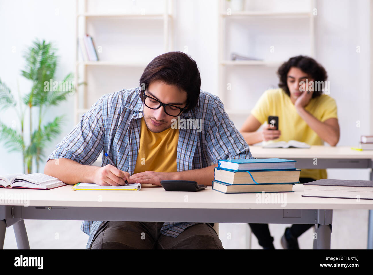 Two male students in the classroom Stock Photo - Alamy