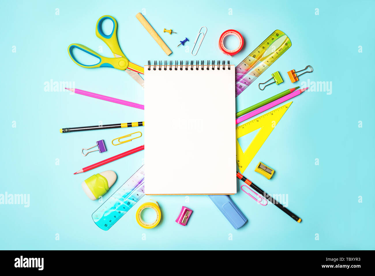 Back to school background with notepad, colorful pencils, square ruler ...