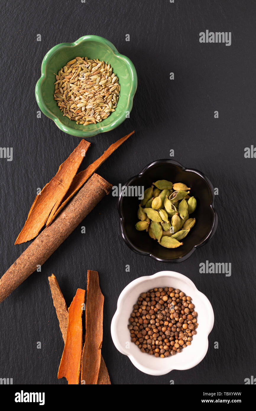 Food concept assortment Oriental spices cardamom pods, coriander seeds ...