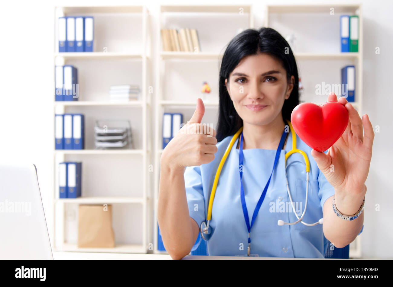 Female doctor cardiologist working in the clinic Stock Photo - Alamy