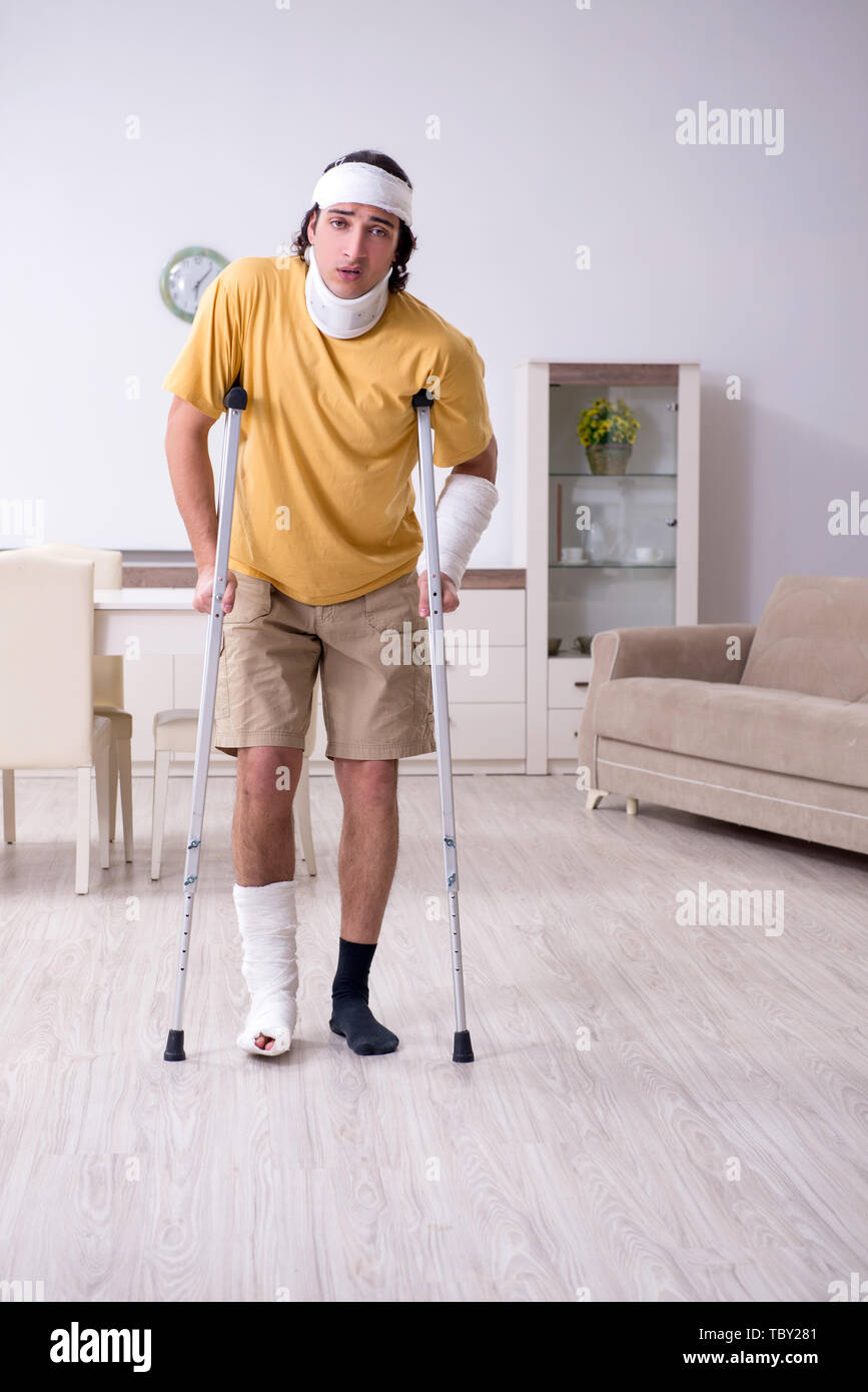 Young man after accident recovering at home Stock Photo - Alamy