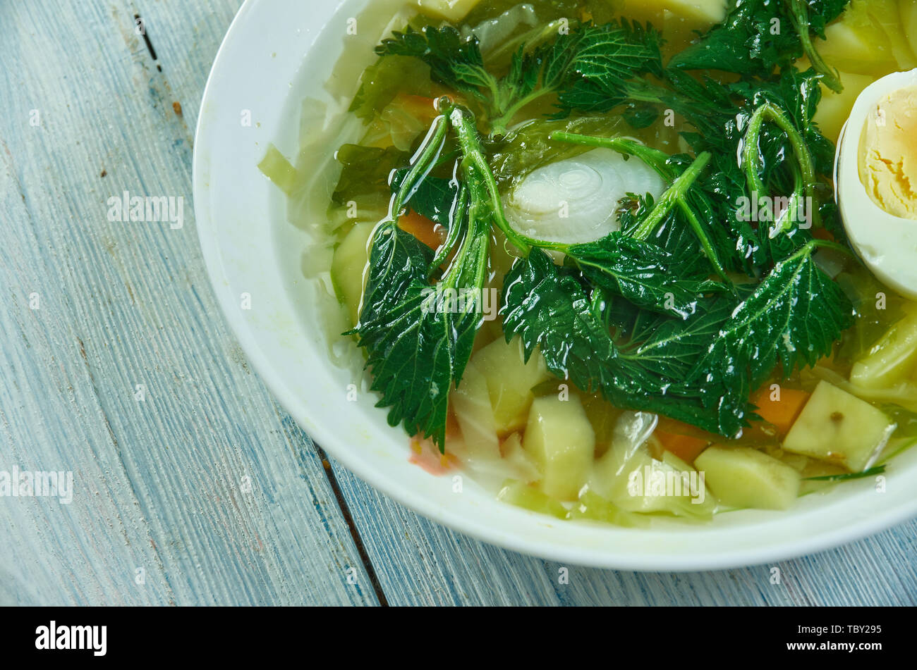 Spring vegetable soup nettle with egg, close up Stock Photo - Alamy