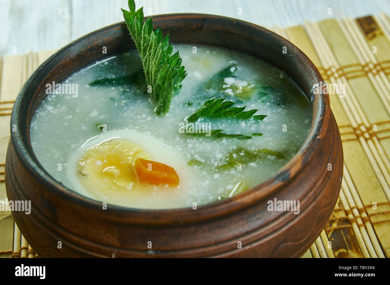 Spring vegetable soup nettle. Country style Stock Photo - Alamy