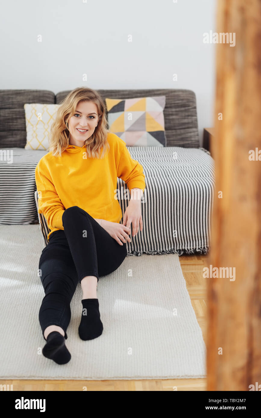 Woman leaning on back of sofa hi-res stock photography and images - Alamy