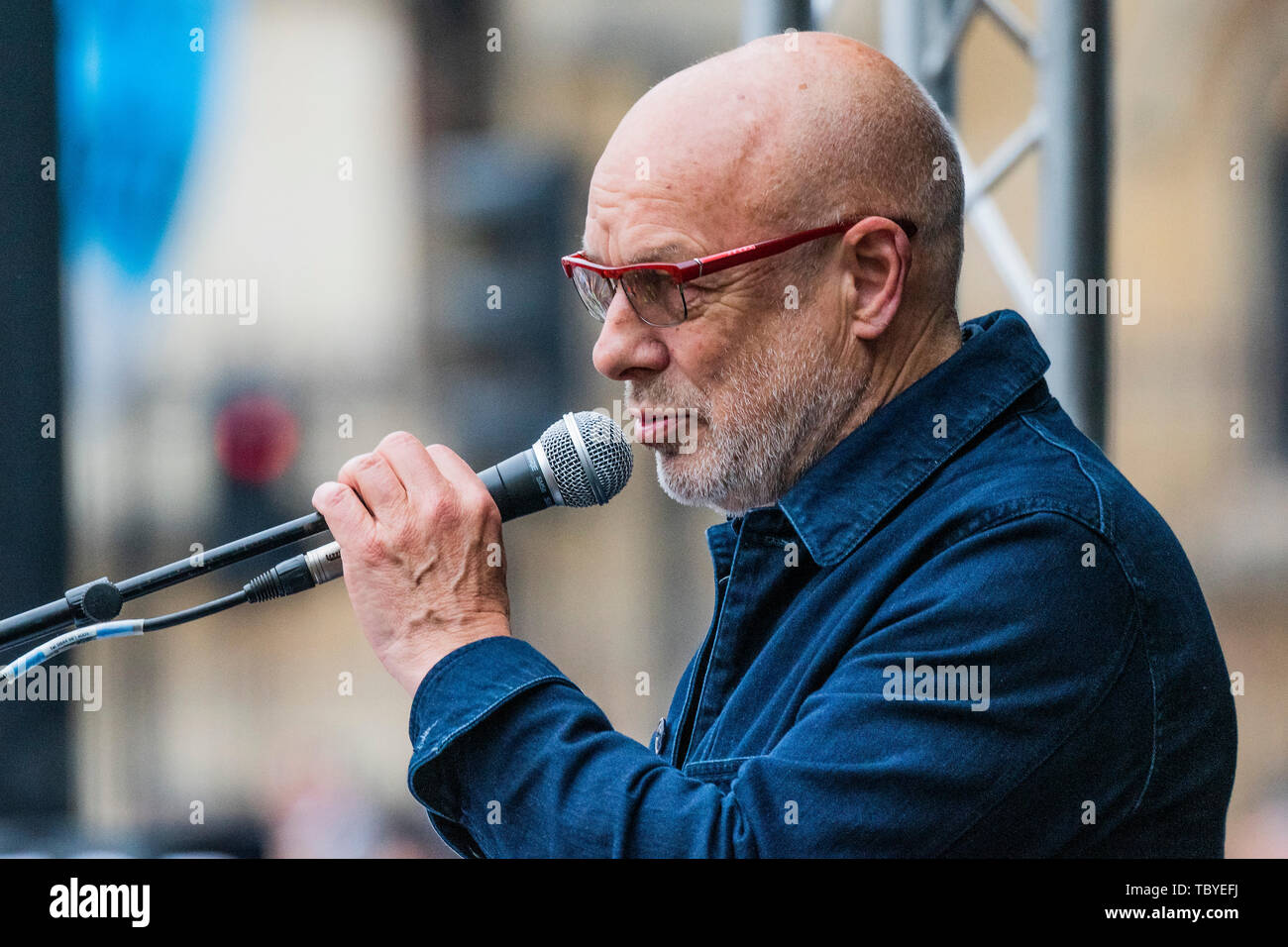 London, UK. 4th June, 2019. Brian Eno speaks - People protest the visit ...